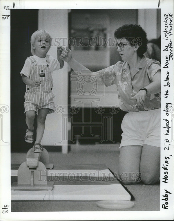 1987 Press Photo Robby Hoskins balance beam instructor Jennifer Marine ...