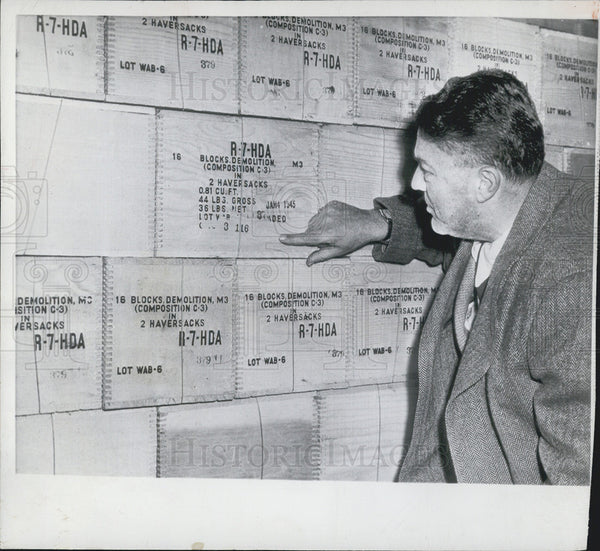 Det Merritt Kent examines cases of explosives that were seized 1948 ...