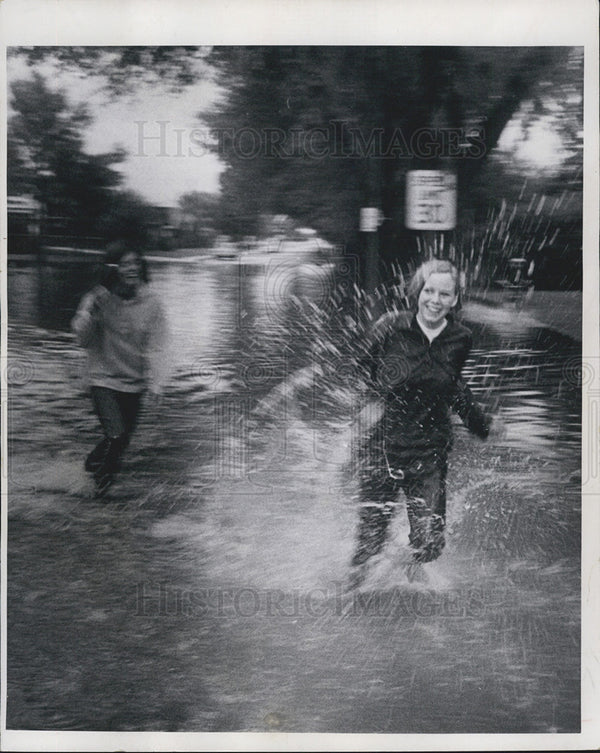 Debbie Williams runs through the flooded streets of Denver 1968 Vintage ...