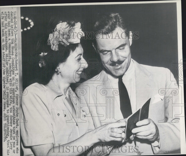 1948 Robert T. Miller confers with his wife after appearance - Historic ...
