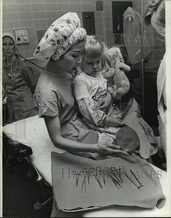 1979, Corazon Puzon shows child medical tools in Birmingham hospital ...