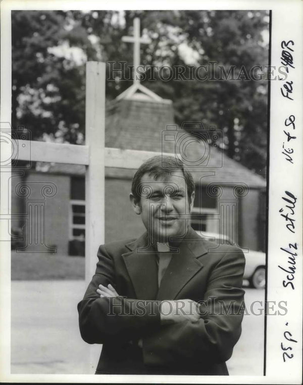 1980 Clergyman Norman Schultz in front of church - Historic Images