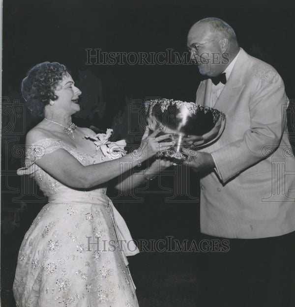 1955 Mrs. Morris Bush receives gift from Mervyn Sterne at Party ...