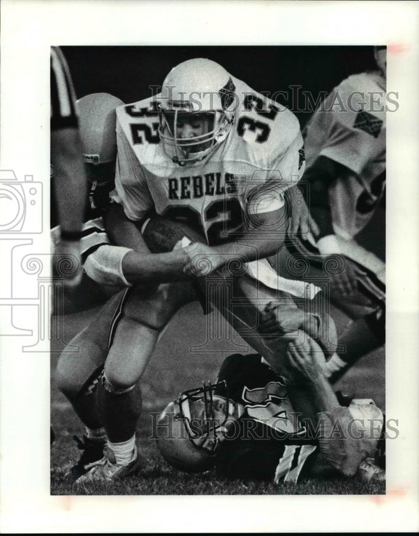 1991 Press Photo Wickcliffe's Chris Ball C#41 tries to pull down Matt ...