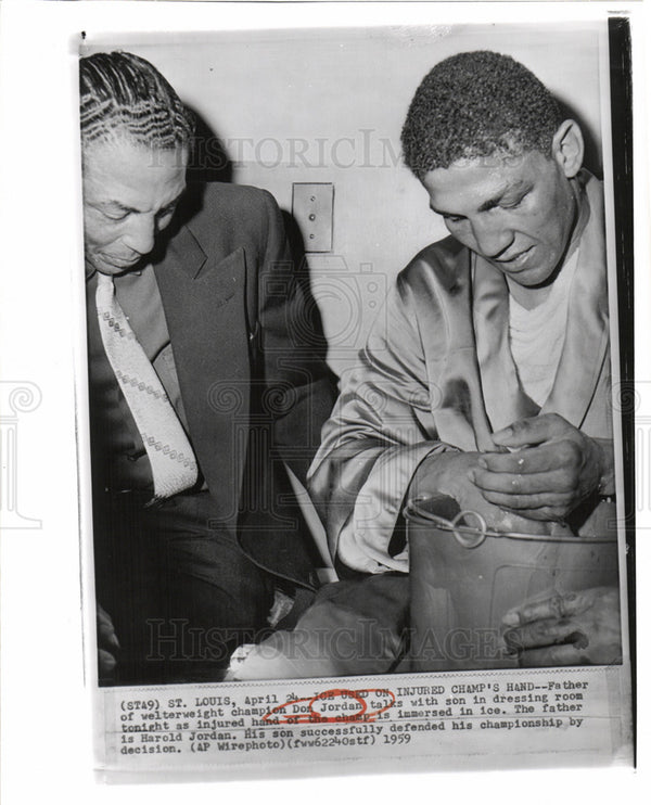 1959, Don Jordan boxing champion icing hand - Historic Images