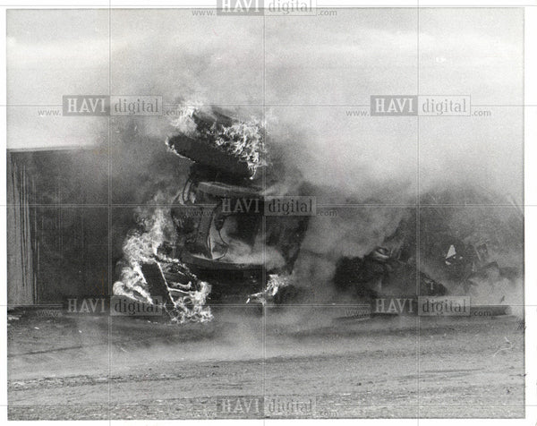 Tire aflamed 1977 Vintage Photo Print - Historic Images