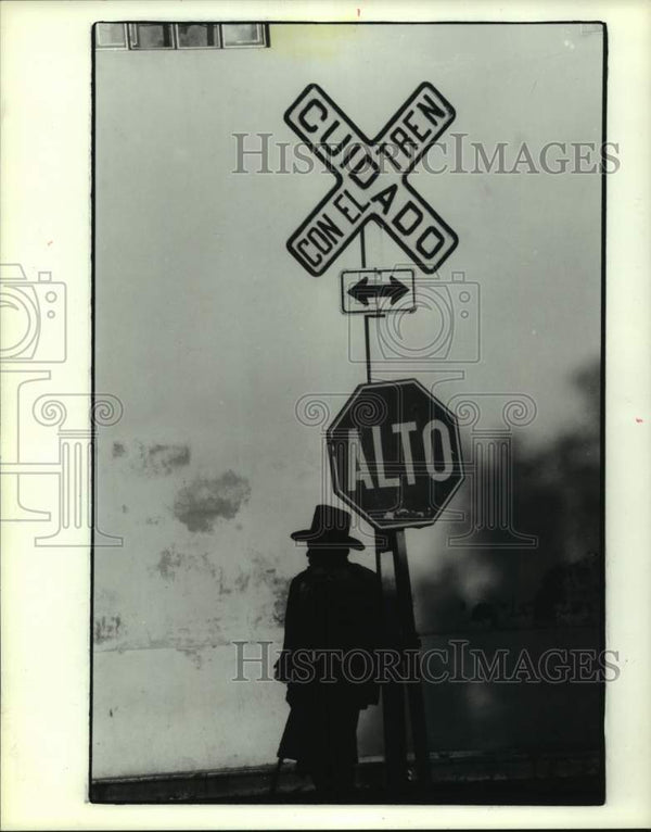 1987 Stop sign (in Spanish) by train crossing in Sierra Blanca ...