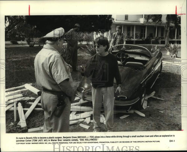 1991 Press Photo Michael J. Fox and Tom Lacy in a scene from "Doc Holl ...