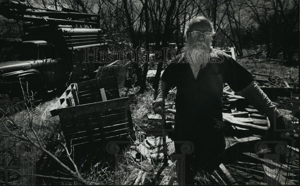 1991 James Couch showing visitor around his yard in New Berlin ...
