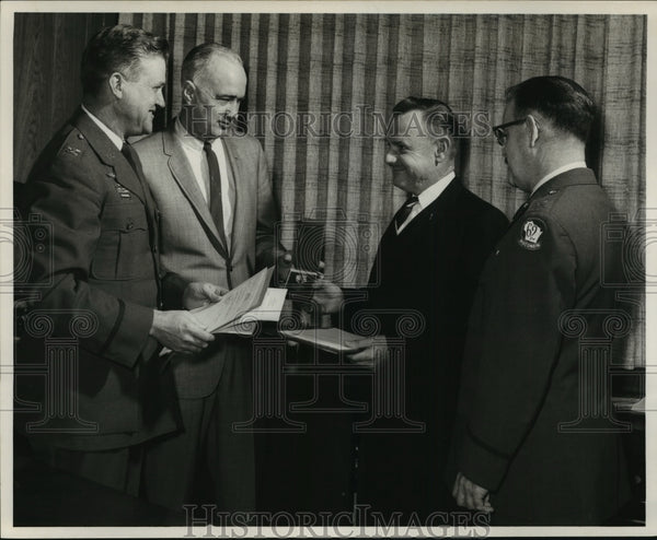 1965 Donald E. Mott presented with citation and award for service ...