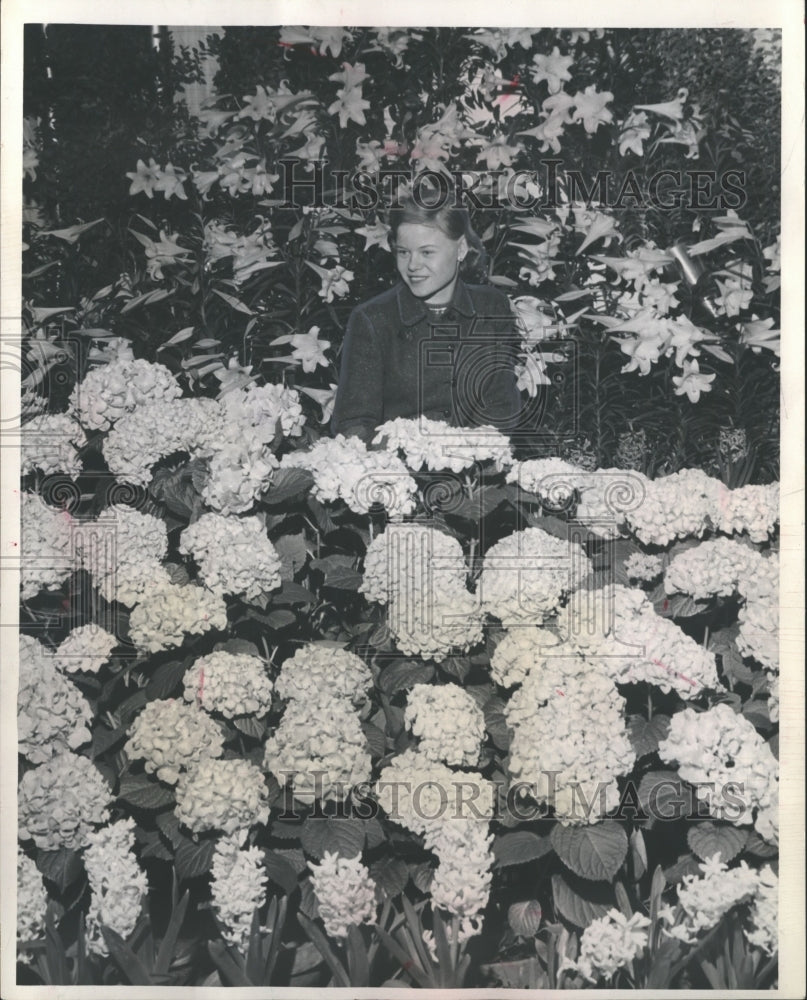 1964 Joan Sanderson sits amongst flowers at Milwaukee Florist show ...