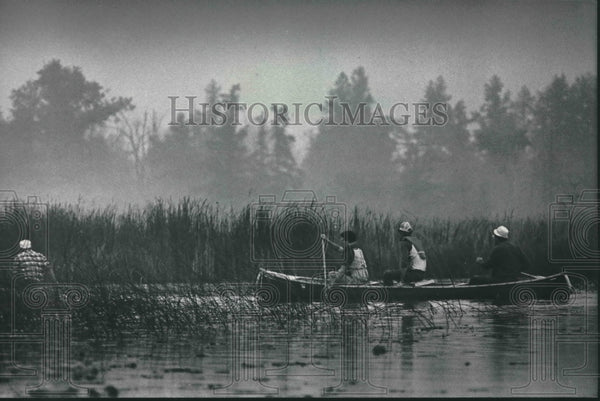 1984 Canoeists enter foggy marsh on Ashippun Lake. - Historic Images