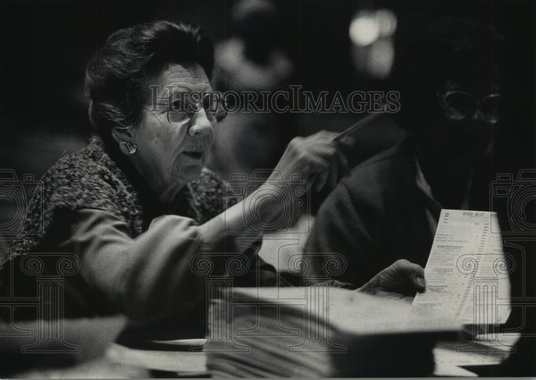 1988 Julia Holmes hands out ballot to voter at Webster Middle School ...