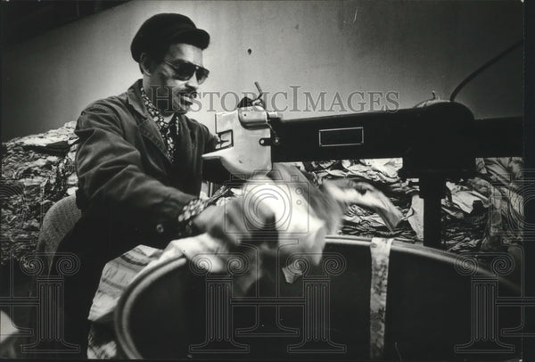 1981 Eddie Gooch working a machine at Goodwill Industries - Historic Images
