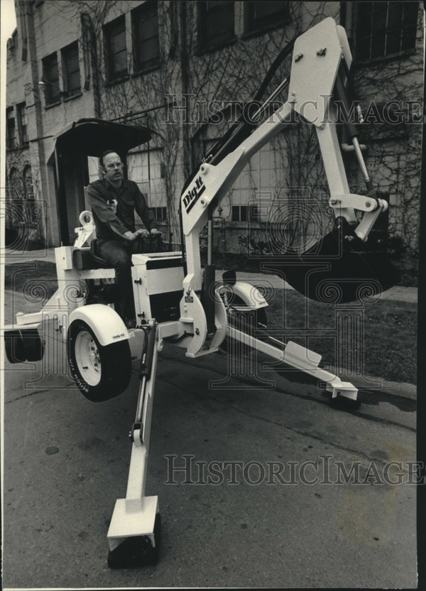 1987 A tiny backhoe made by Spancrete Industries, Milwaukee. - Historic ...