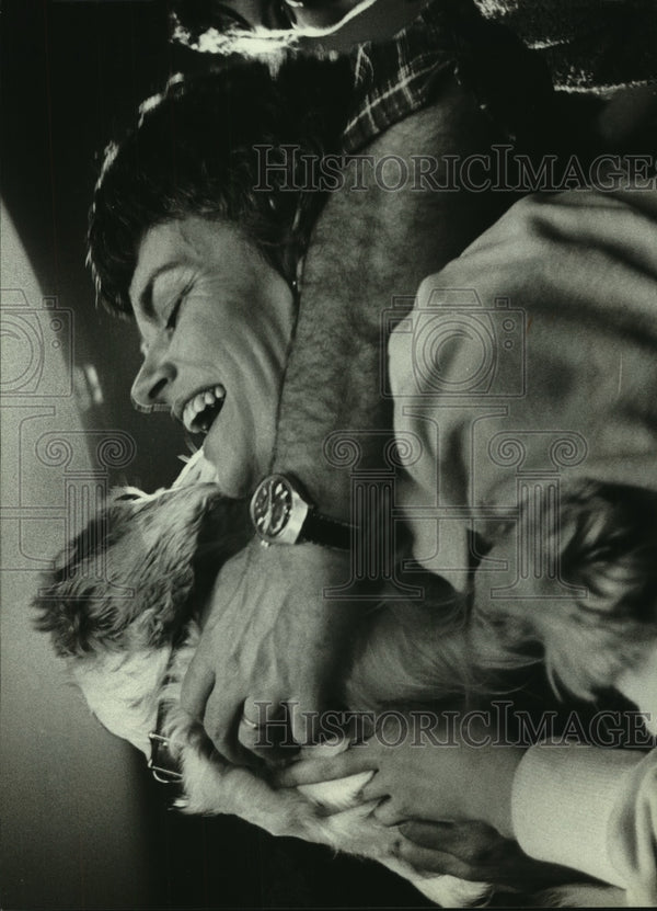 1981 Barbara Timm hugged family dog at her Oak Creek home - Historic Images