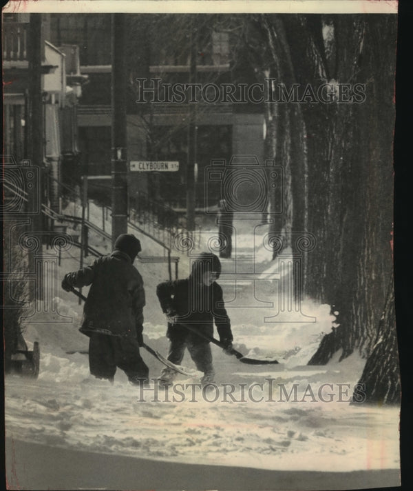 1964 Press Photo Two young boys shoveled snow to clear sidewalk in Mil ...