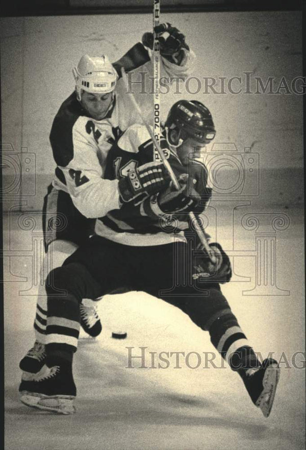 1989 Milwaukee Admirals player Curtis Hunt battles Mike Hiltner ...