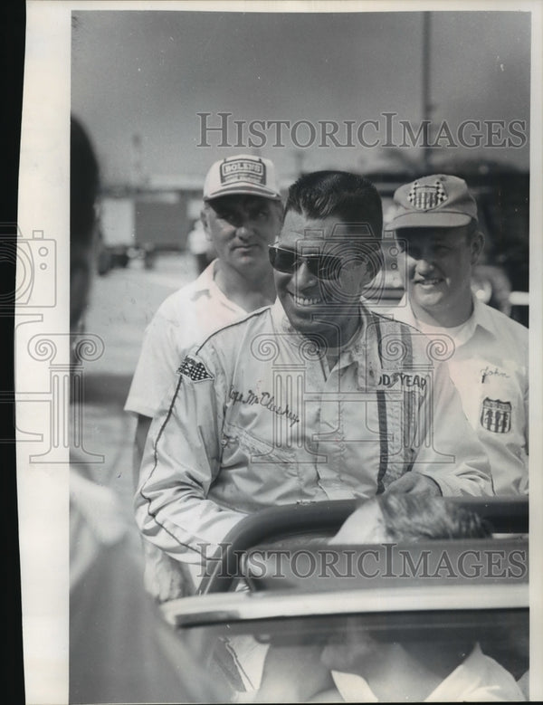 1969 Race car driver Roger McCluskey riding in an open car. - Historic ...