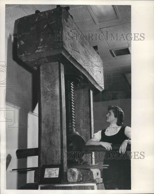 1955 Jean Riehl at Institute of Paper Chemistry displays a press ...