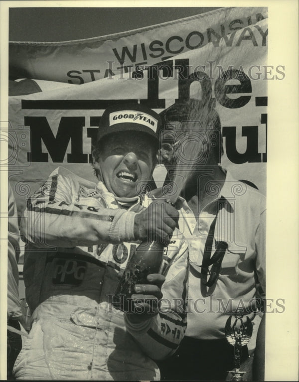 1984 Press Photo Tom Sneva celebrates winning the Dana-Rex Mays 200 ...