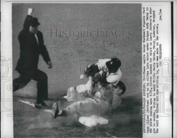 1962 Third base umpire Kenny Burkhart signals at Card Gene Olicer ...