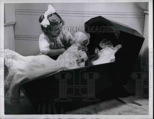 1957 Jody Dunn trying out crib from George Washington's family ...