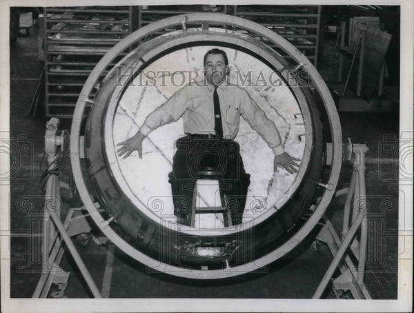 1959 A man inside a searchlight frame in a demonstration of it ...