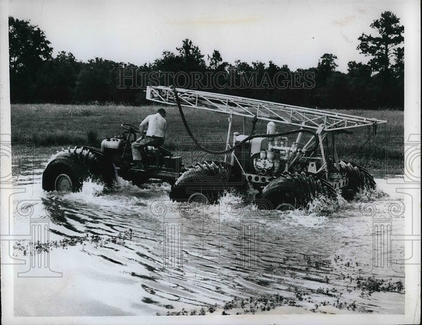 View Of Man Riding Machine In Water - Historic Images