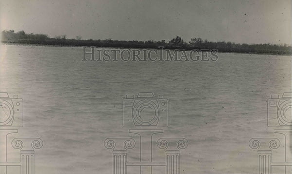 1920 Press Photo A lake with a forest in the background. - Historic Images