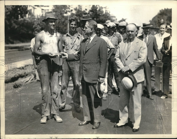 1933 Press Photo Secretary of interior Ickes being greeted by Worker ...