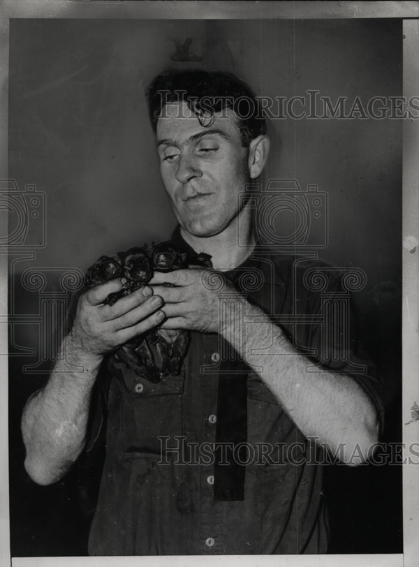 1935 Press Photo Terrence White with Bulldog Puppies Rescued from Sewe ...