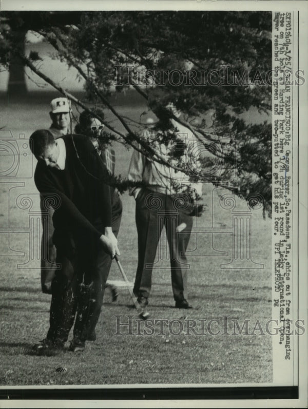 1963 Press Photo George Bayer chips out from overhanging tree in 1st r ...