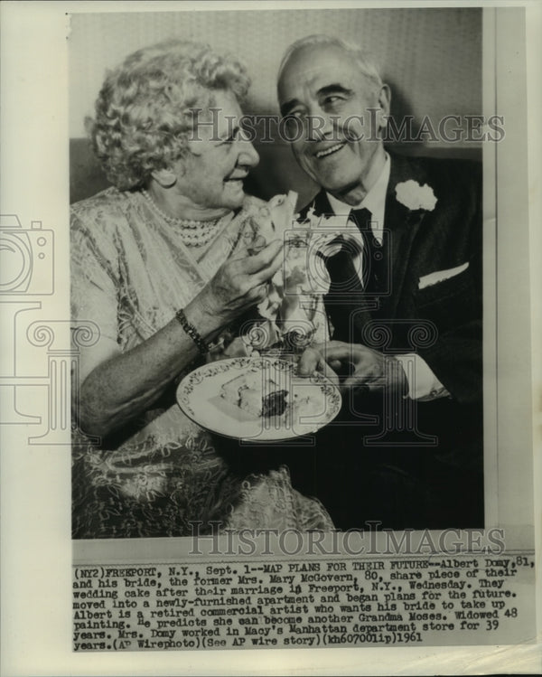 1961 Press Photo Albert Domy & Mary McGovern Share Cake at Their Weddi ...