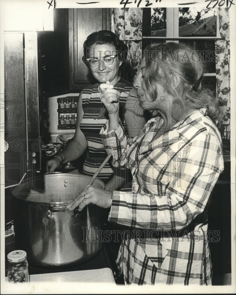 1972 Mrs. Paddison tastes her Jambalaya while Mrs. Eggen looks on ...