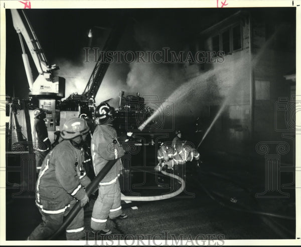 1992 Press Photo Firemen battle 7-alarm fire on St. Claude near Touro ...