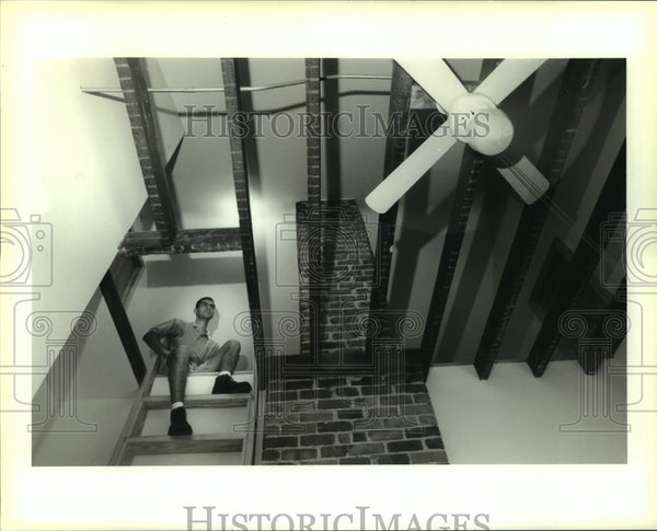 1995 Steven Hal sits in unfinished loft that he uses for storage ...