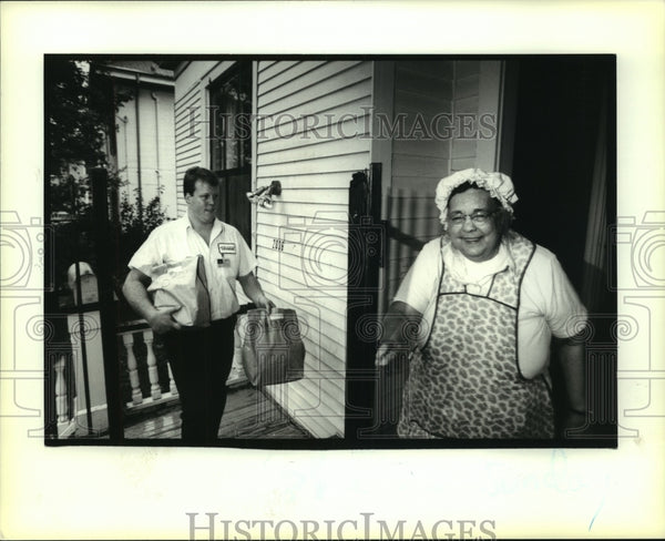 1991 Senior Alice Porter opens gate to let Bryan Smith deliver order ...