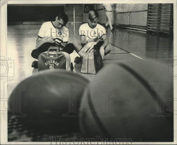 1967 Daniel Digby, Richard LeBlanc writing names on travel bags ...