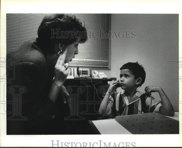 1994 Press Photo Tammy Crabtree signals to Rhett to test his new heari ...