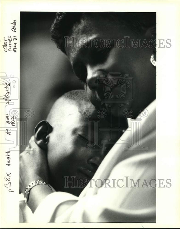 1994 Rodrick Smith comforted by Carmel Mire- Laurel Elementary ...