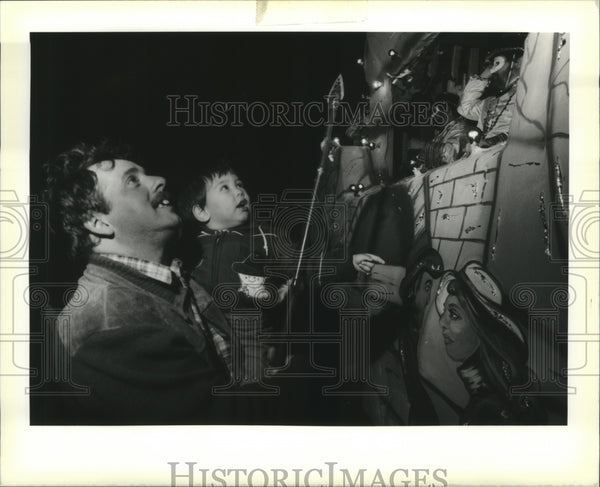 1990 Christopher Morris watches krewe of Gladiator Mardis Gras Float ...