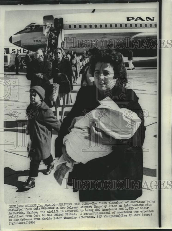 1966 Americans and their relatives deplane at New Orleans Airport ...