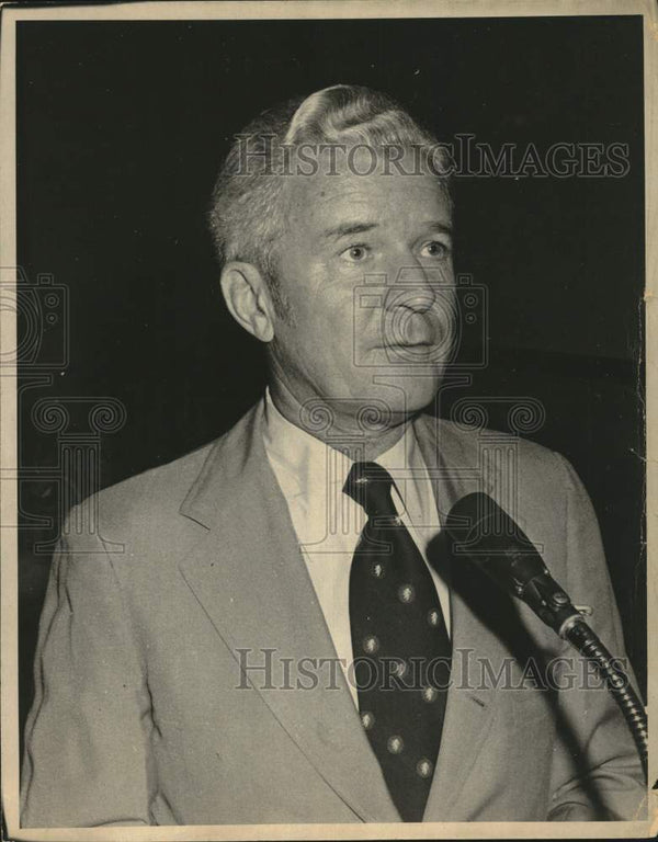 1974 General Robert McDermott speaks before microphone. - Historic Images