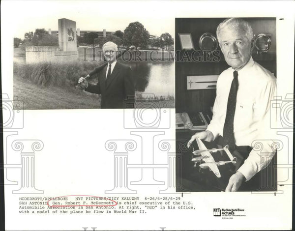 Robert McDermott holds model of plane in his San Antonio office ...