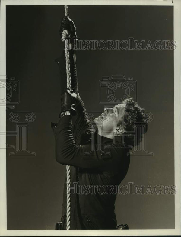 Actor Dack Rambo Climbs Rope - Historic Images