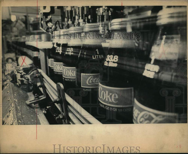 Press Photo Coca-Cola bottles in the assembly line at Erickson Coke Pl ...