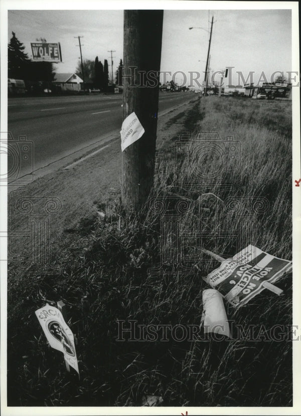 1990 Press Photo Election Scene, election signs down on ground on side ...