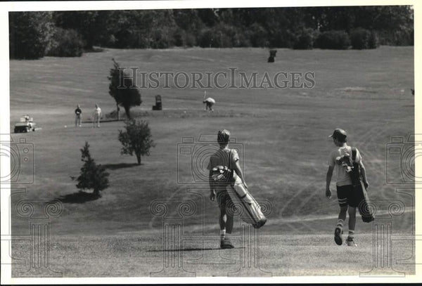 1990 Press Photo David Brown & Josh Trembly playing golf at Rusitc Gol ...
