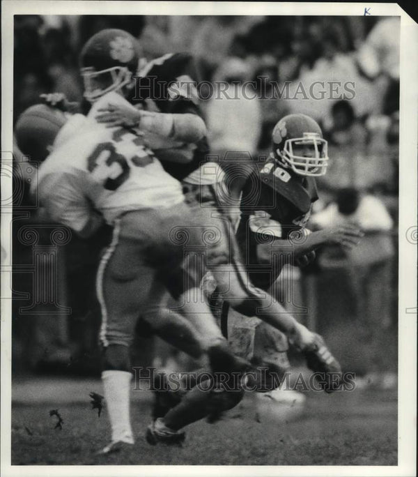 1987 Press Photo Corcoran football player Rick Williams slides around ...